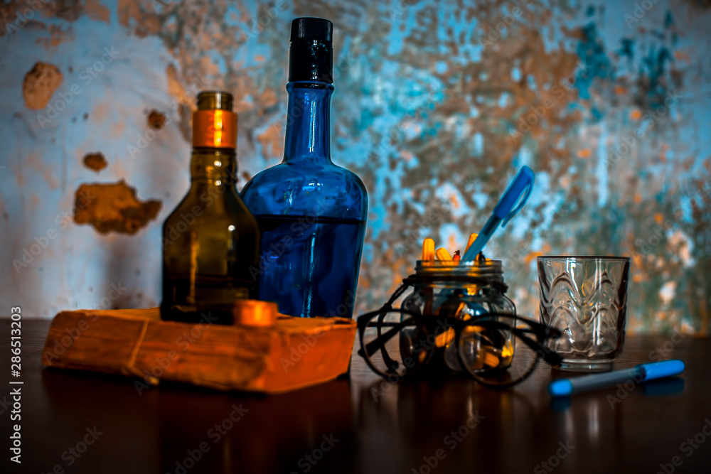 Traditional set alcohol bottle with glasses on a wooden table along ...