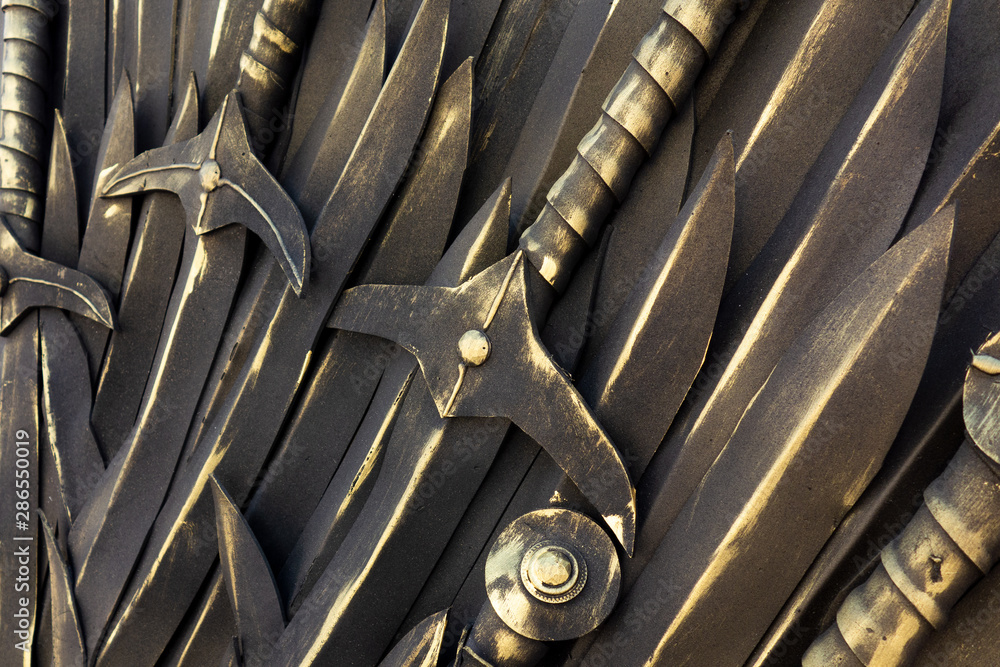 Swords background. Piles of ancient bronze cold weapon close up view ...