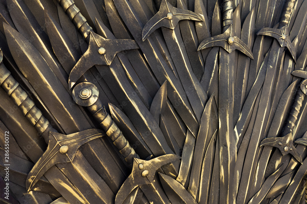 Swords background. Piles of ancient bronze cold weapon close up view ...