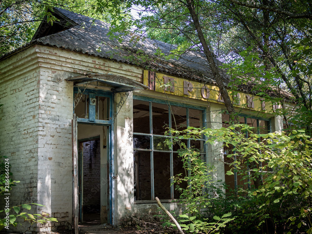 Facade of the abandoned looted grocery store in Zalissya village in ...