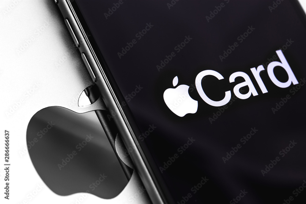 iPhone and Apple Card logo on the screen. Apple is a multinational ...