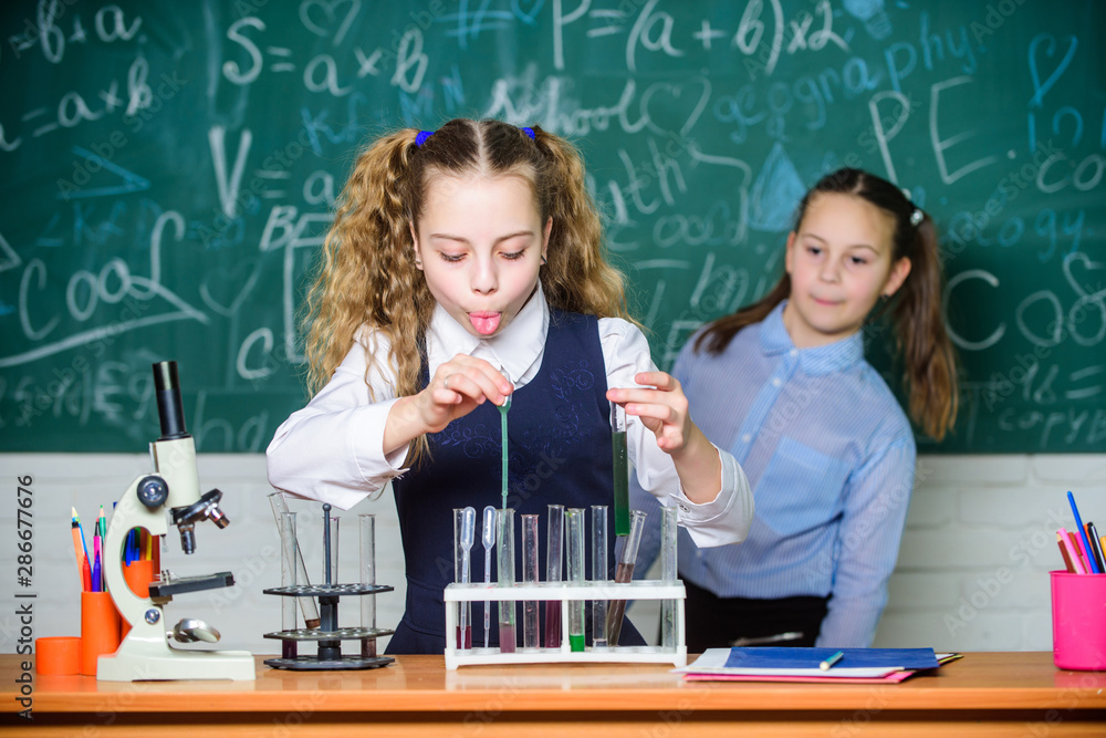 School laboratory. Girl smart student conduct school experiment. School ...