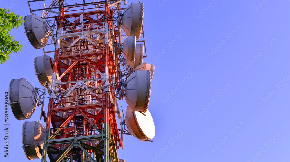 Telecommunications tower, an antenna and a satellite dish, network ...