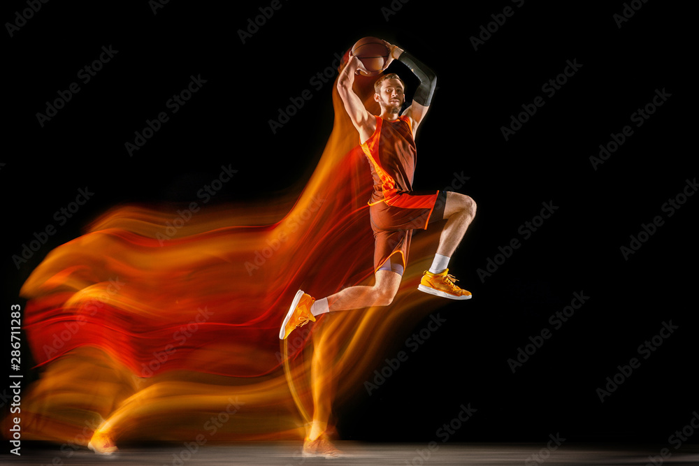 Becoming a winner. Young caucasian basketball player of red team in ...