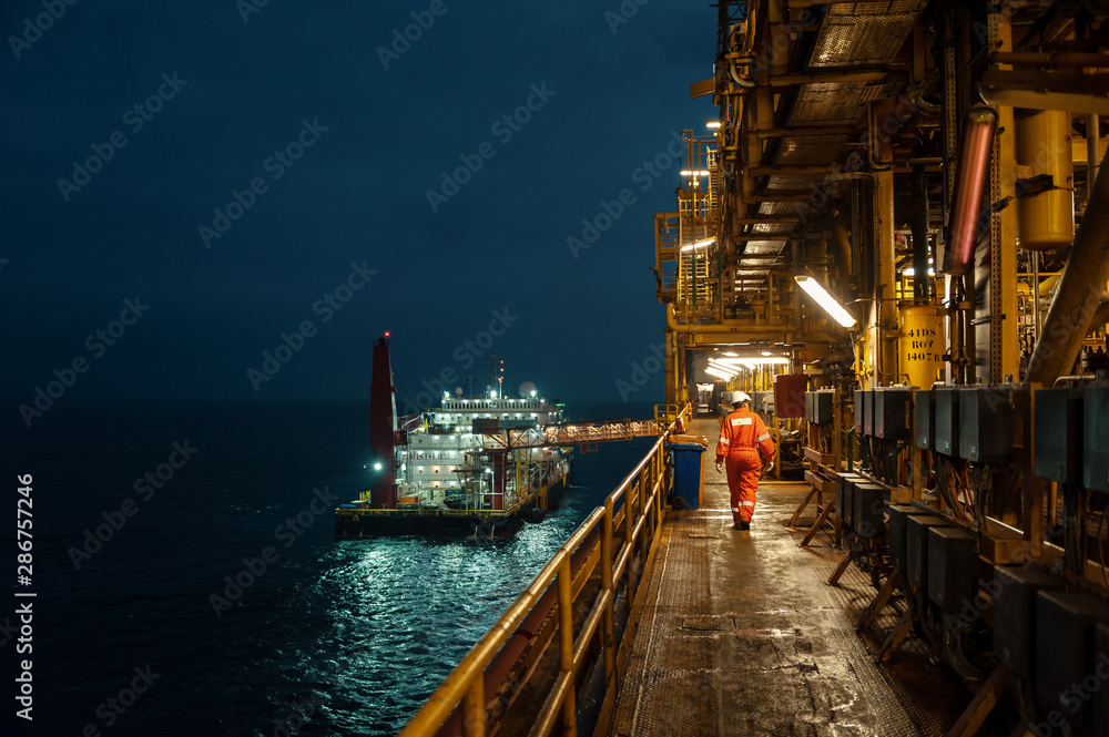 Man walking on offshore vessel Stock Photo | Adobe Stock