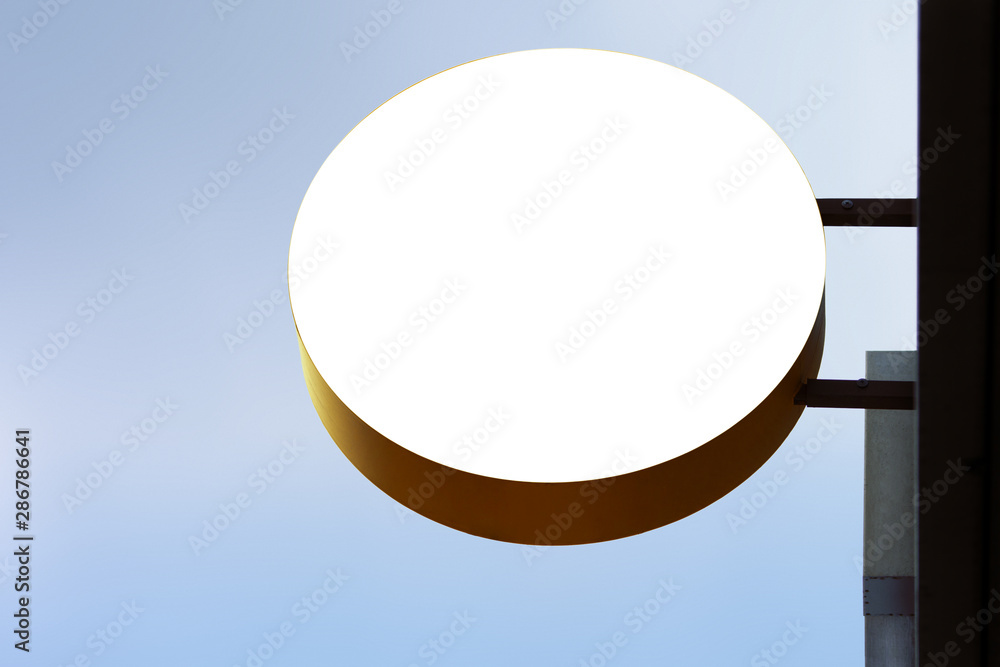 Round signboard mockup. Shop, store exterior signage on sky background ...