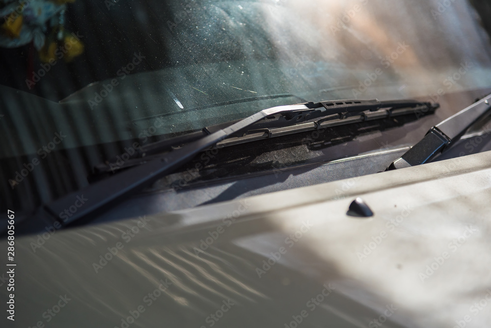 Car wiper of car parked on street sunlight background. Stock Photo ...