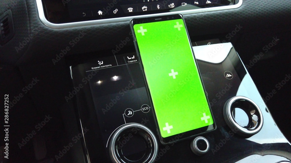Smartphone in car dashboard with green screen background Stock Photo ...