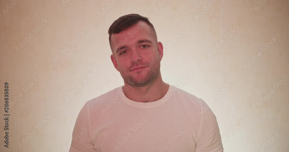 Portrait og handsome man turn on camera side and acting emotions and ...