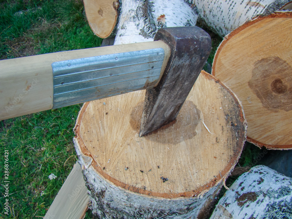 Cleaver is stuck in a birch chock. Wooden hatchet. Metal blade. Stock ...