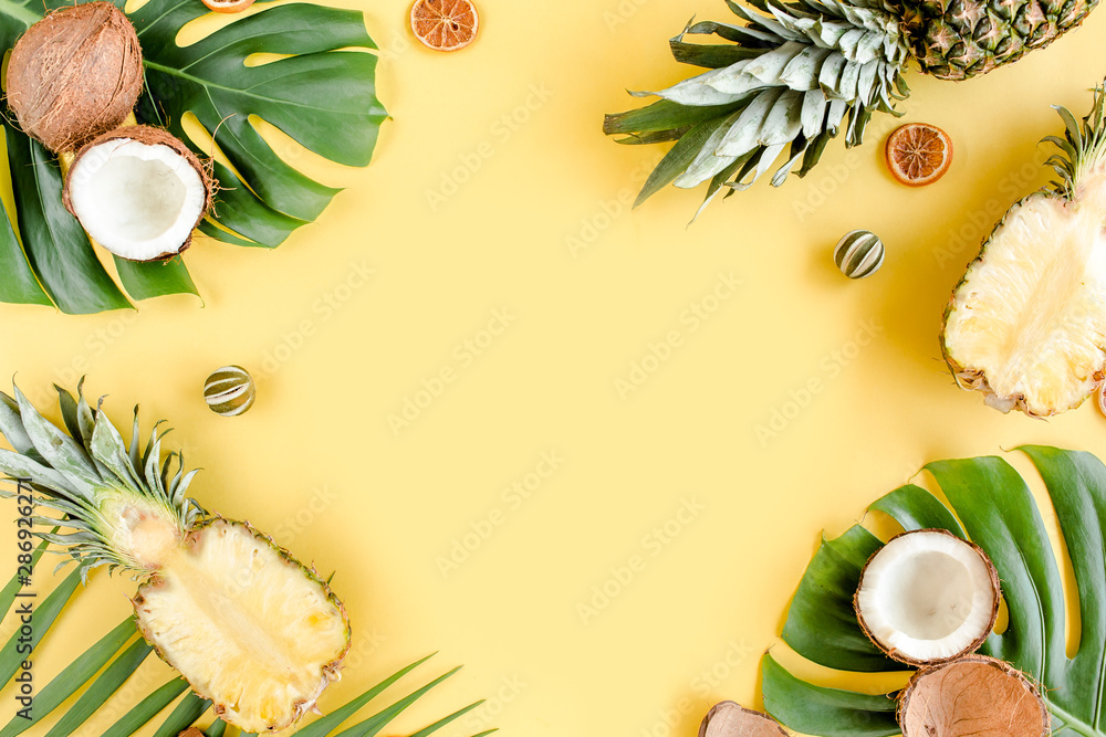 Tropical frame, background with exotic fruits and tropical palm leaves ...