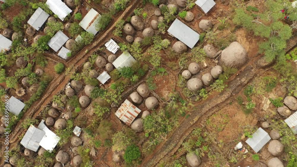 Vidéo Stock Flying over traditional village with classic homes and ...