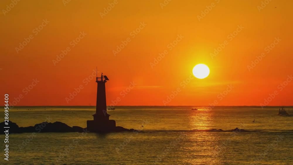 Landscape of Sinchang Windmill Coast with a lighthouse. The coast is ...