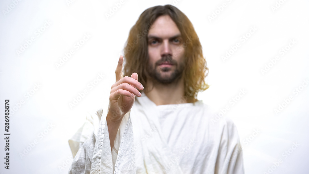 Jesus raising finger, warning against sin, teaching Christians ...