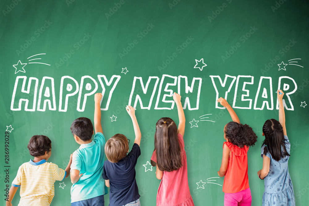 school children drawing happy new year on the chalkboard Stock Photo ...