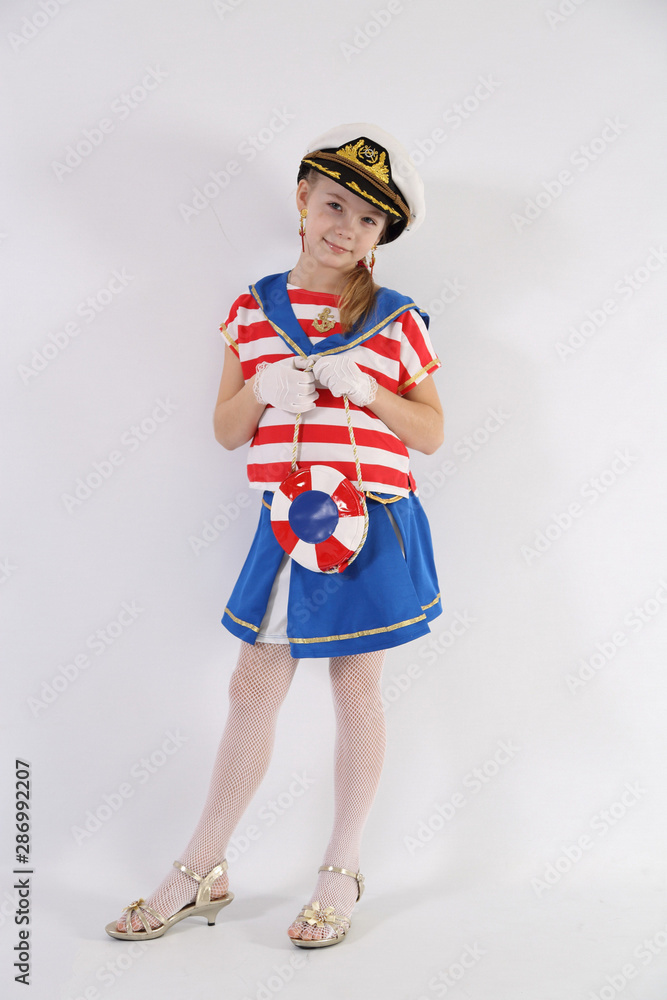 beautiful young girl in a sailor suit on a white background Stock Photo ...