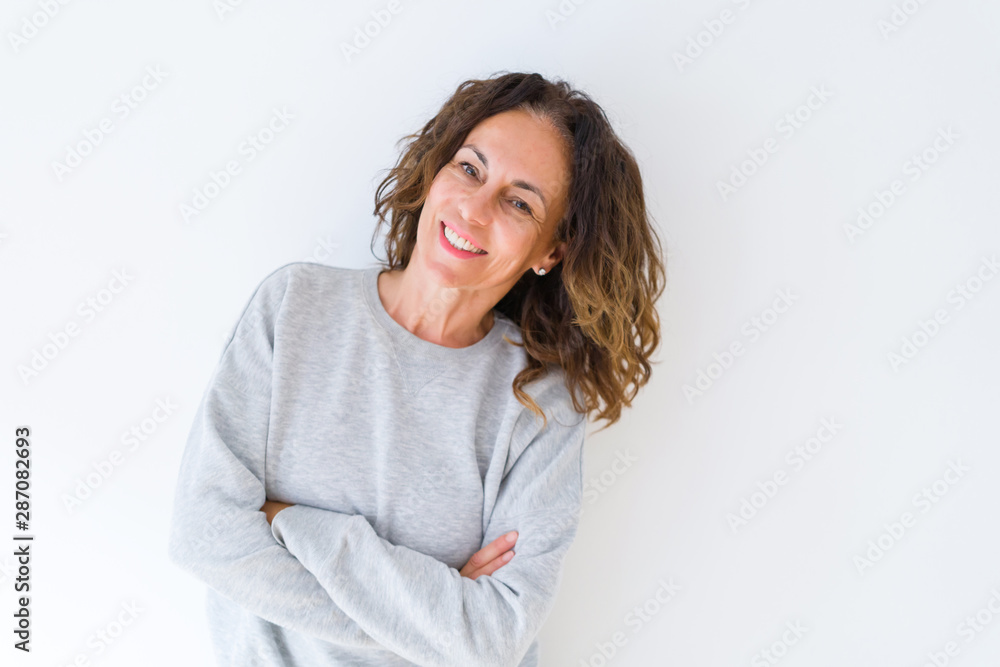 Beautiful middle age woman with curly hair smiling cheerful and happy ...
