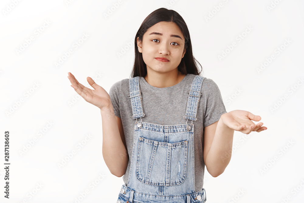 Girl not know. Cute young asian vietnamese brunette woman shrugging ...