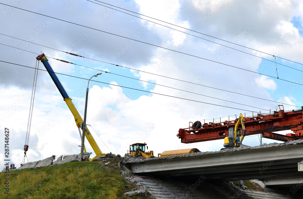 Mini excavator with a hydraulic hammer breaker crushes concrete ...