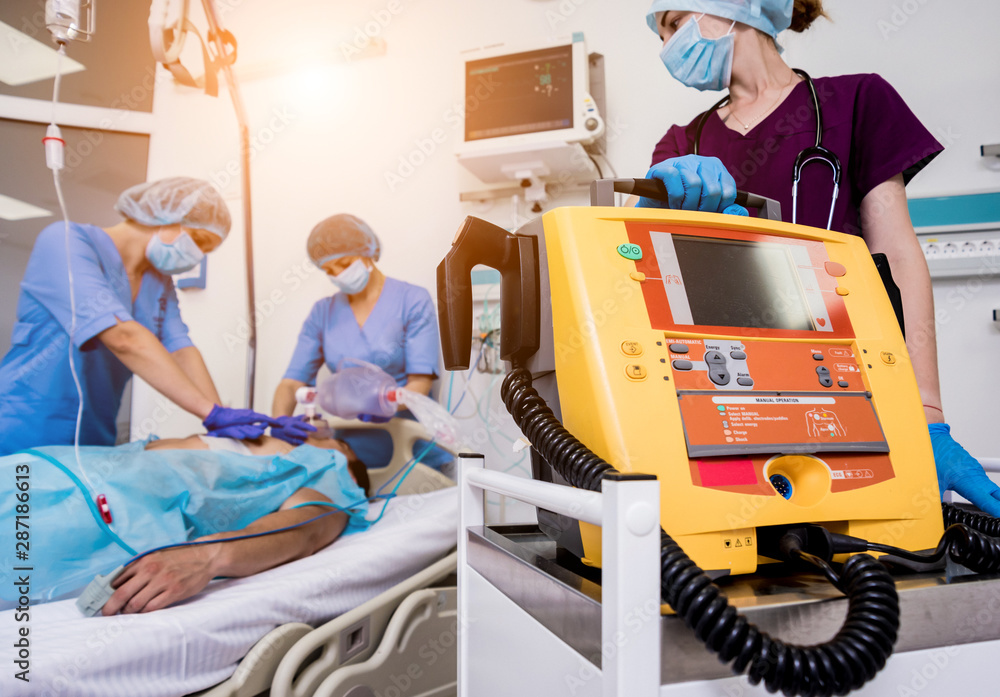 Doctors give resuscitation to a male patient in the emergency room ...