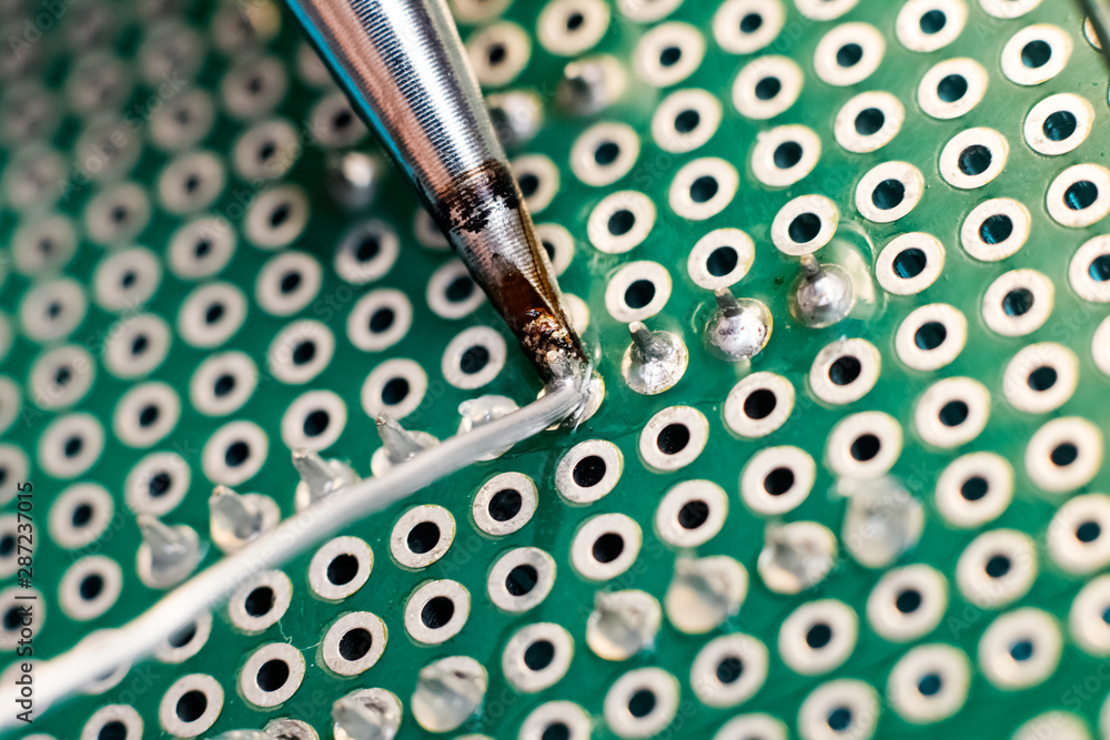 Soldering process, hot soldering iron and breadboard Stock Photo ...