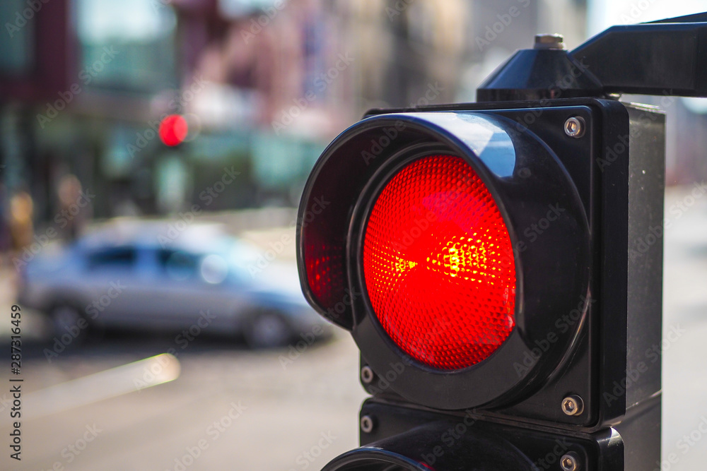 Red light on pedestrian traffic light in the street junction in the ...