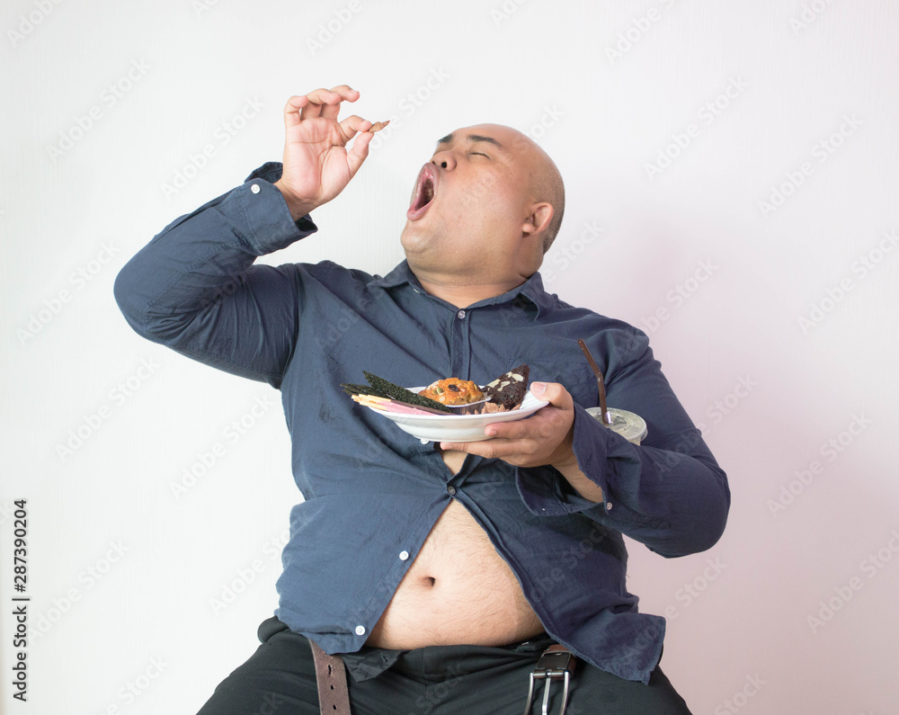 Asian bald fat man with big belly happy in food Stock Photo | Adobe Stock