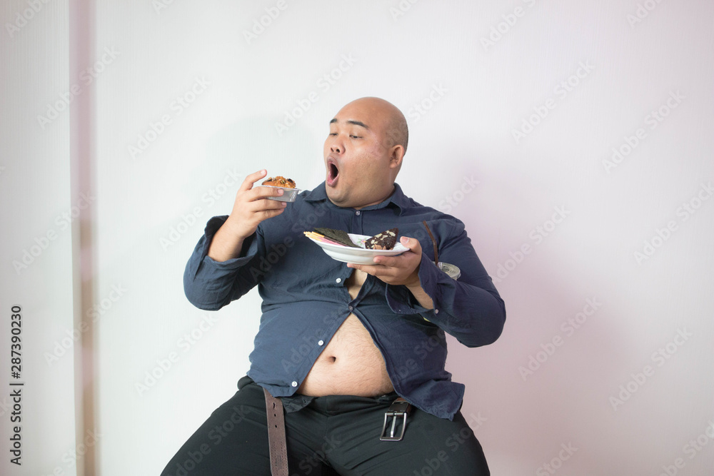 Asian bald fat man with big belly happy in food Stock Photo | Adobe Stock