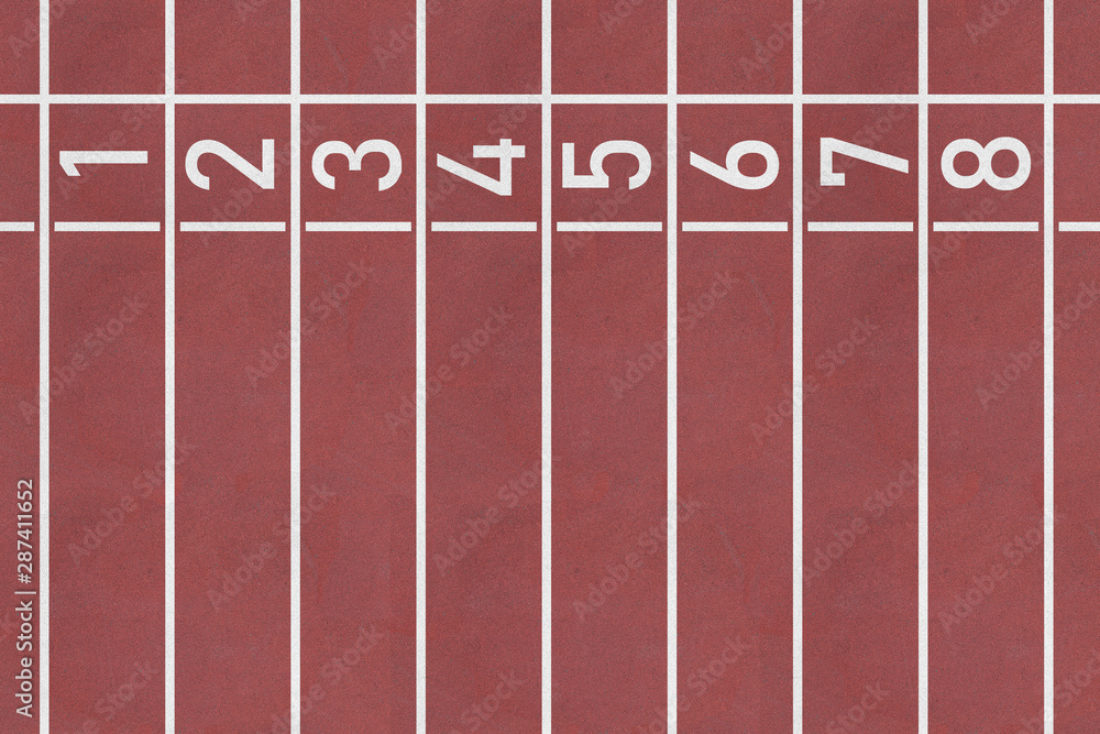 Top view of the red rubber running track texture with markings on the ...
