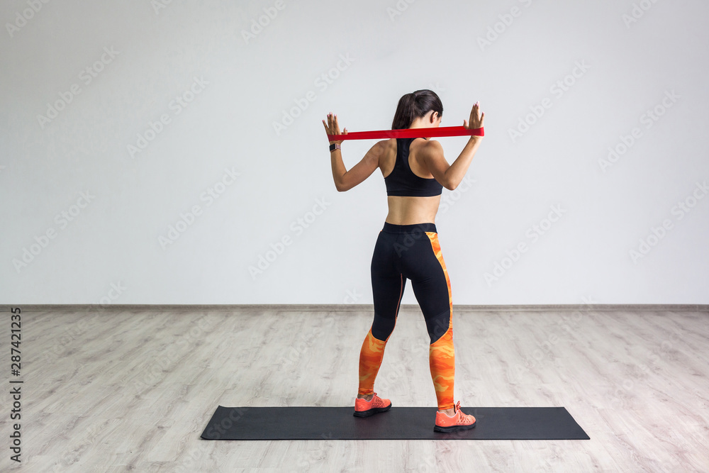 Full length back side portrait of sporty woman wearing in black top and ...