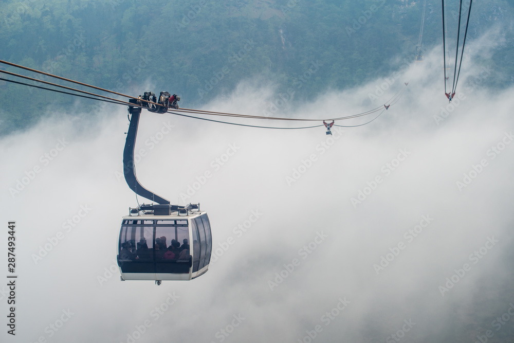 Cable car carrying passengers to Fansipan (3,143 m) mountain the ...