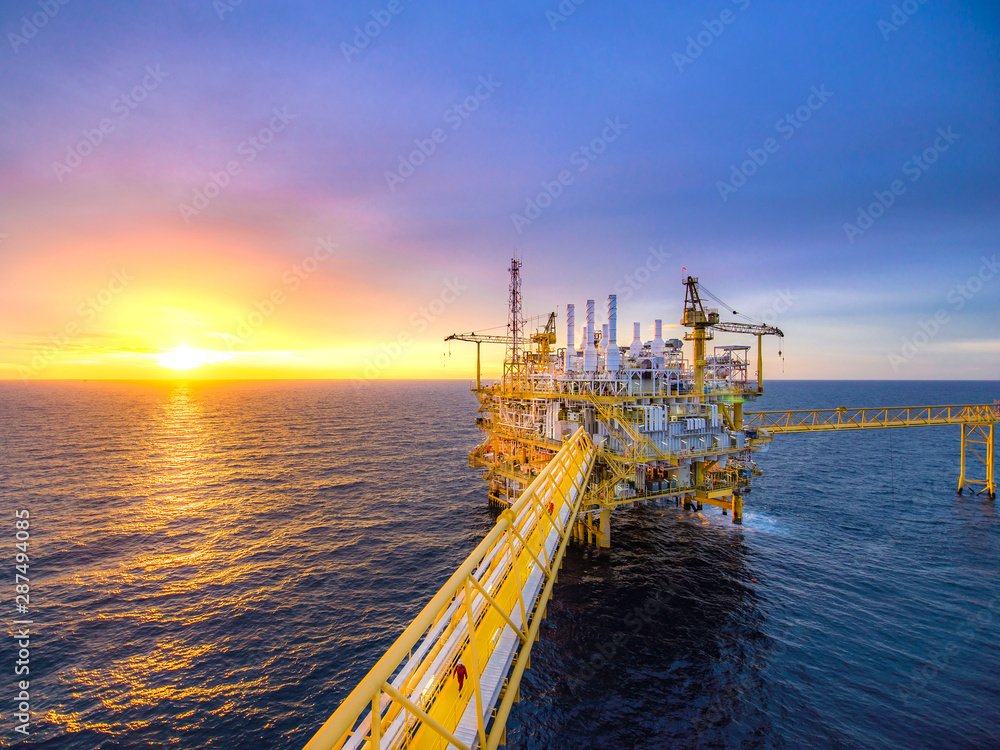 Offshore oil and gas platforms are in the process of releasing gas to ...