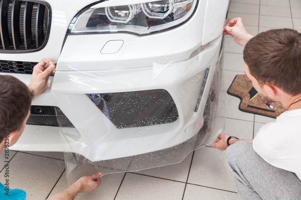 Retrofitting the car with a solid transparent protective film, the ...