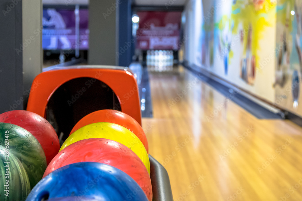 Bowling balls in a row waiting at bowling club Stock Photo | Adobe Stock