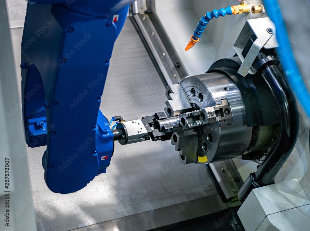 Close up robot hands in milling /drilling metalworking process ...
