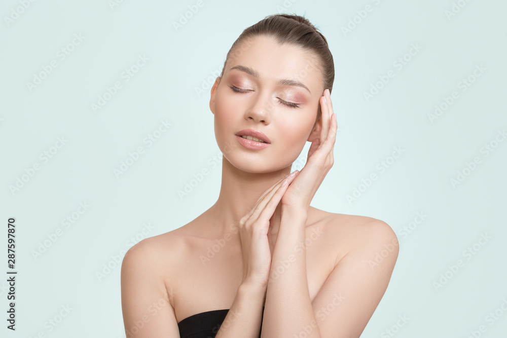 woman with clean skin touches her cheek with her hand. Perfect face ...