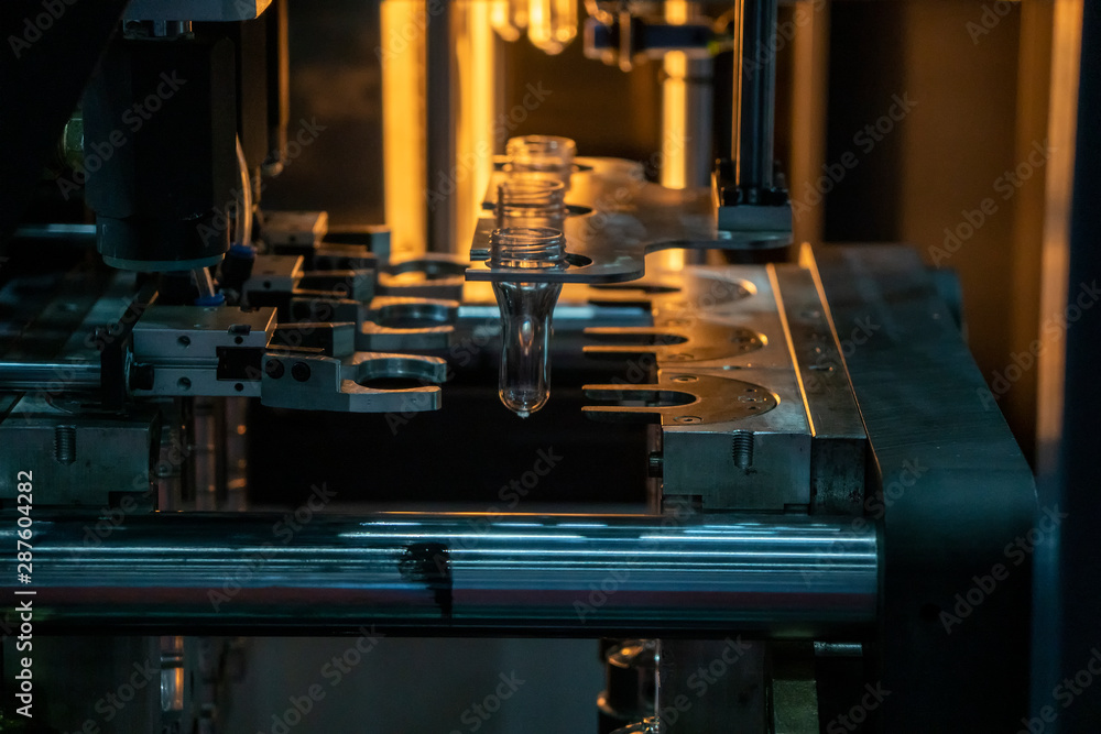 The operation of PET bottle processing by blowing process with the ...