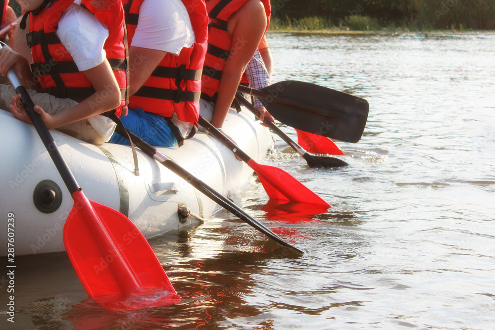 Rafting team , summer extreme water sport. Group of people in a rafting ...