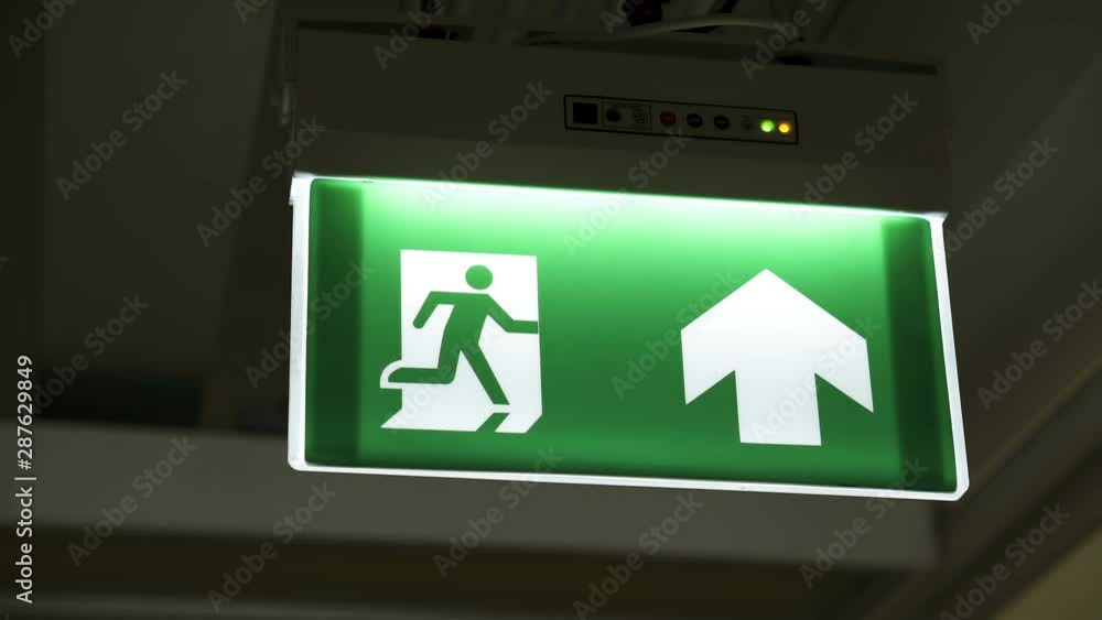 Emergency fire exit sign in doorway office building with siren alarm ...