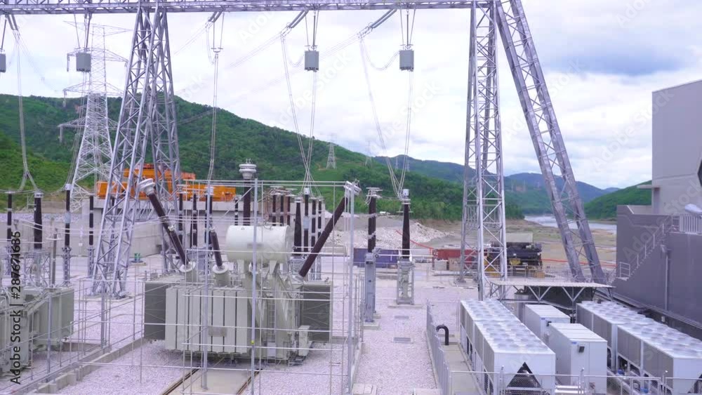 High voltage transformer at the hydroelectric dam.Large power ...