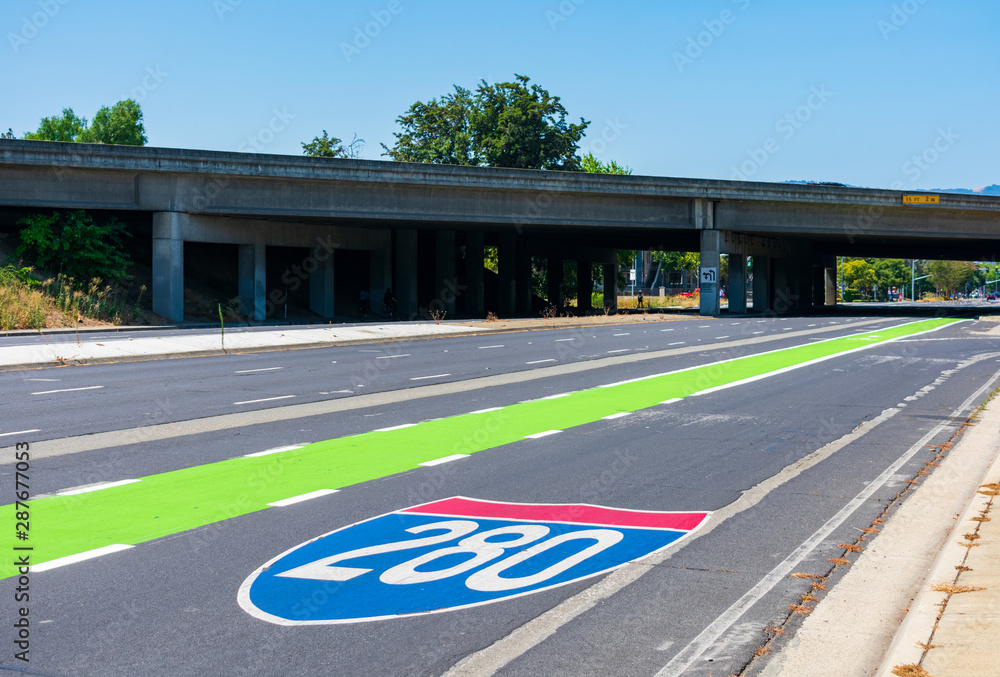 Route shield pavement marking in shape of familiar route shields guide ...