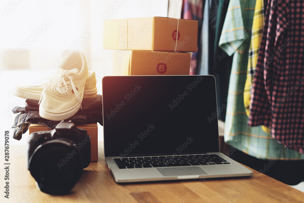 Workplace laptop computer selling online start up small business owner ...