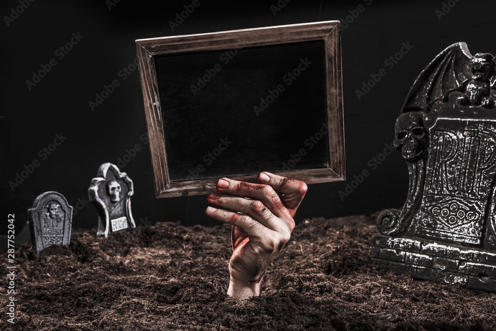 Hand showing black sign out grave Stock Photo | Adobe Stock