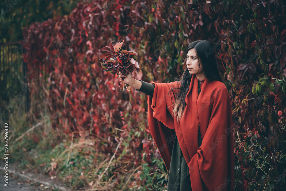 Hypnotized girl with long natural black hair on autumn background of ...
