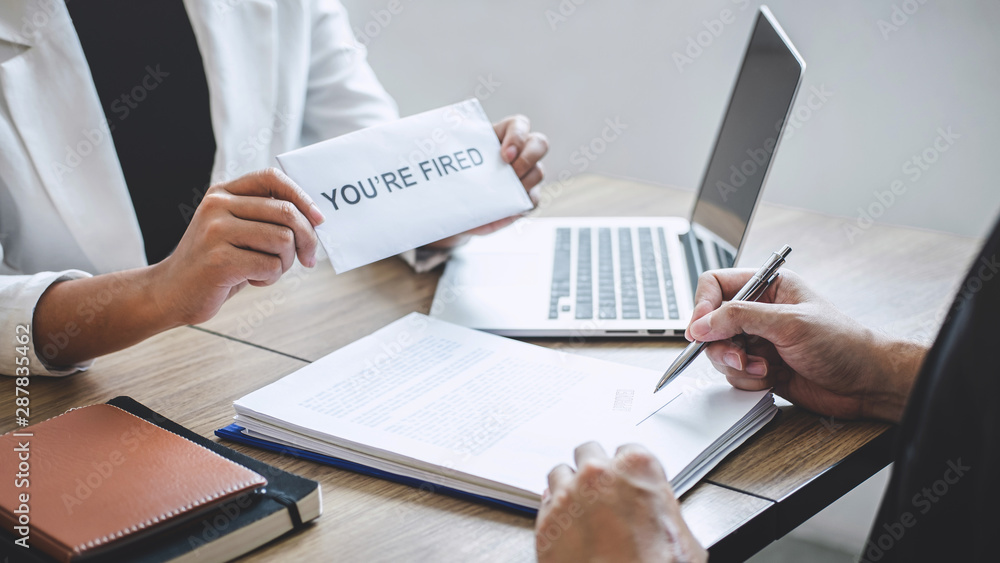 Stressed businessman receive fired letter from employer will be signing ...