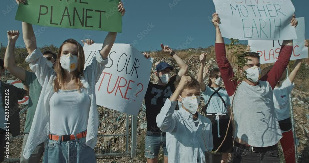 Group of vigorous young people fighting with pollution striking showing ...