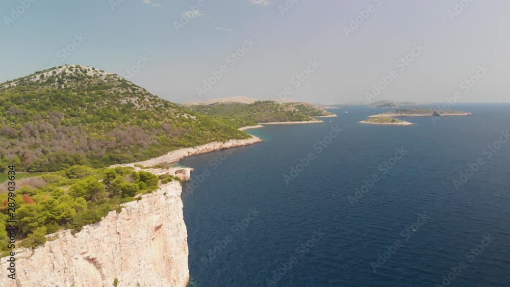 a professional looking aerial of the cliff line of island kornat in ...