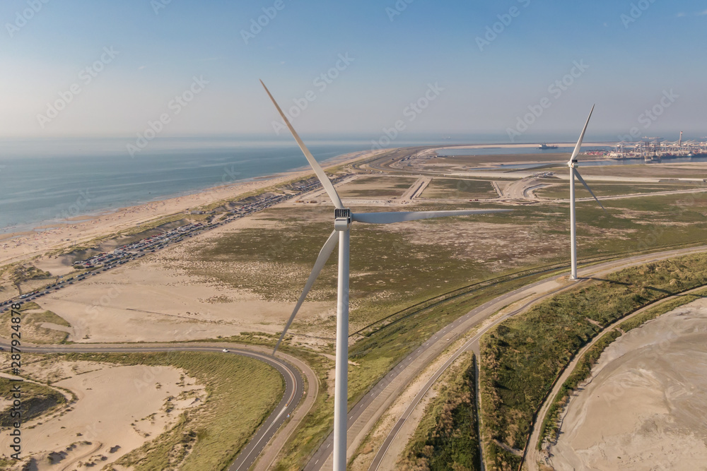 Huge wind turbine on the beach of Maasvlakte II, Rotterdam. With a road ...