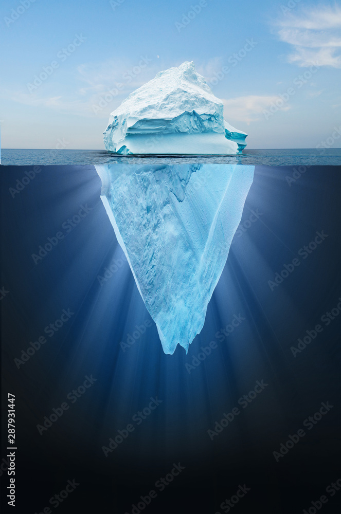 Iceberg floating in the ocean, both the tip and the submerged parts are ...