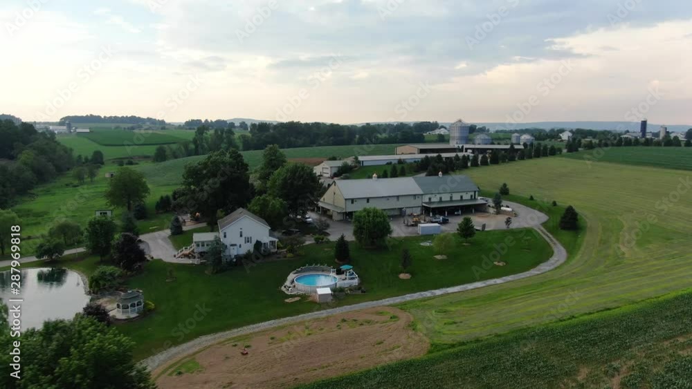 Aerial shot over a farm in Lancaster County, Pennsylvania during summer ...